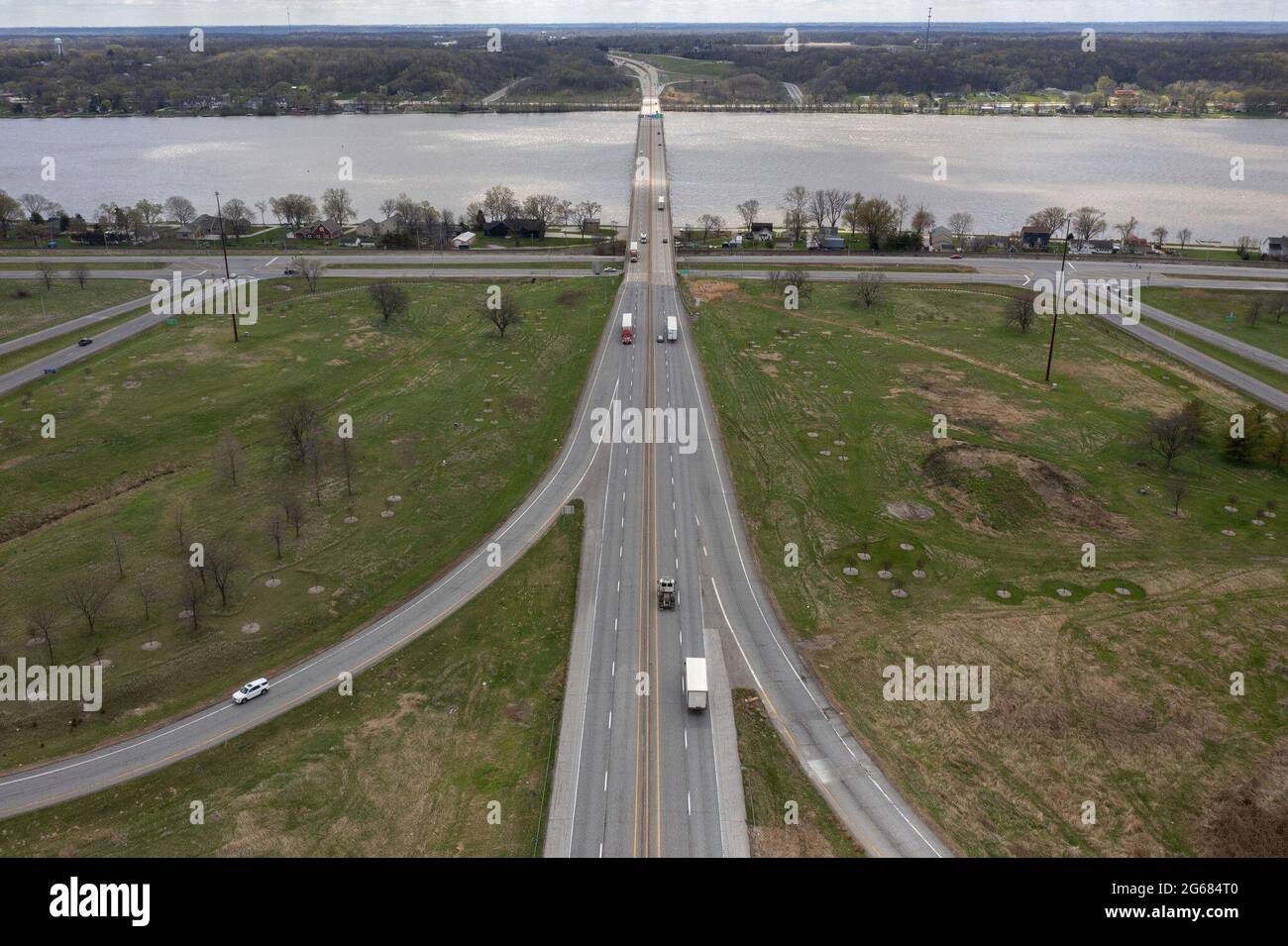 Vehicles drive the Interstate 80 bridge over the Mississippi River ...