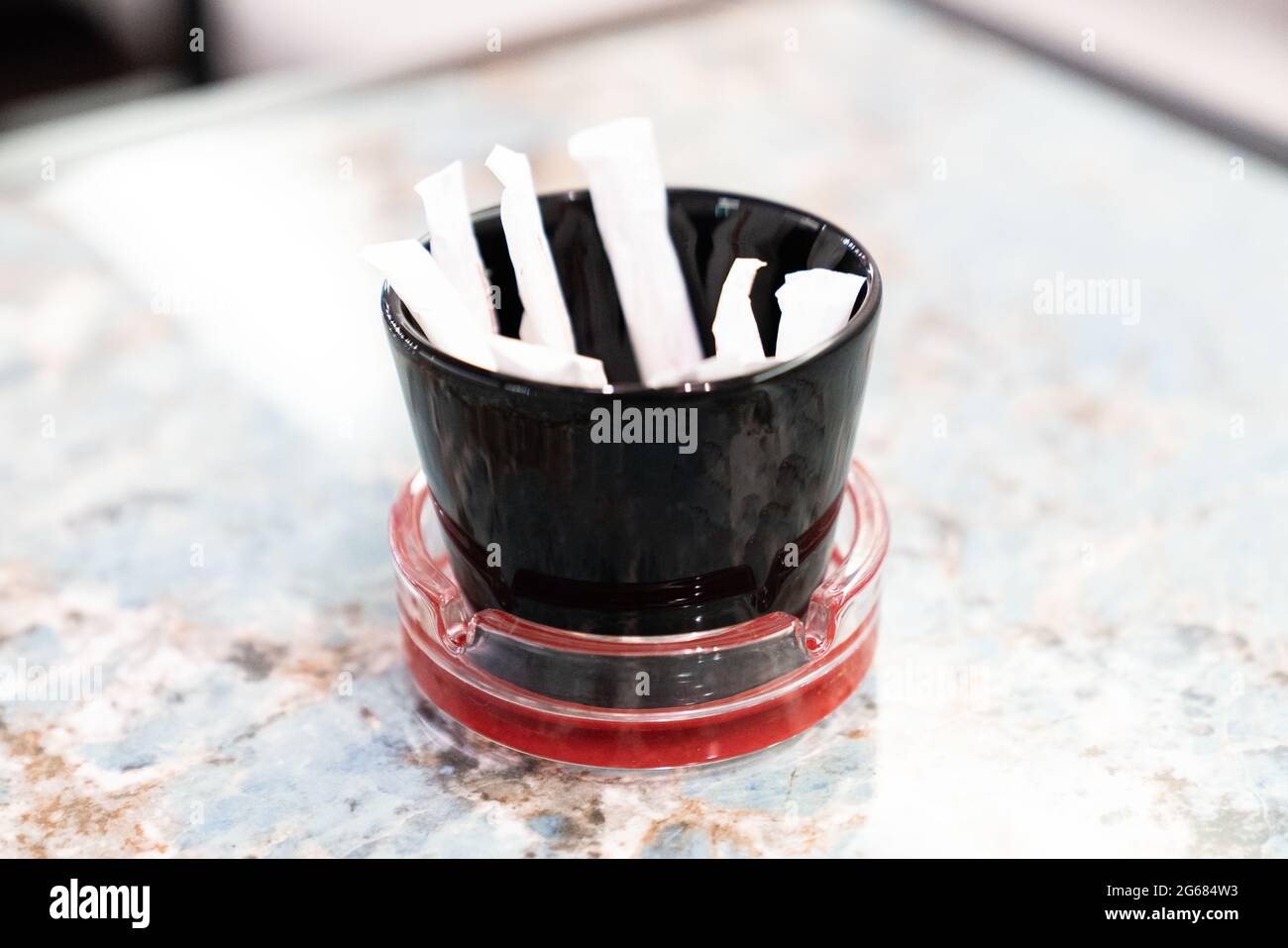 Packaging Sachet Of Sugar Stick Standing On Table Stock Photo - Alamy