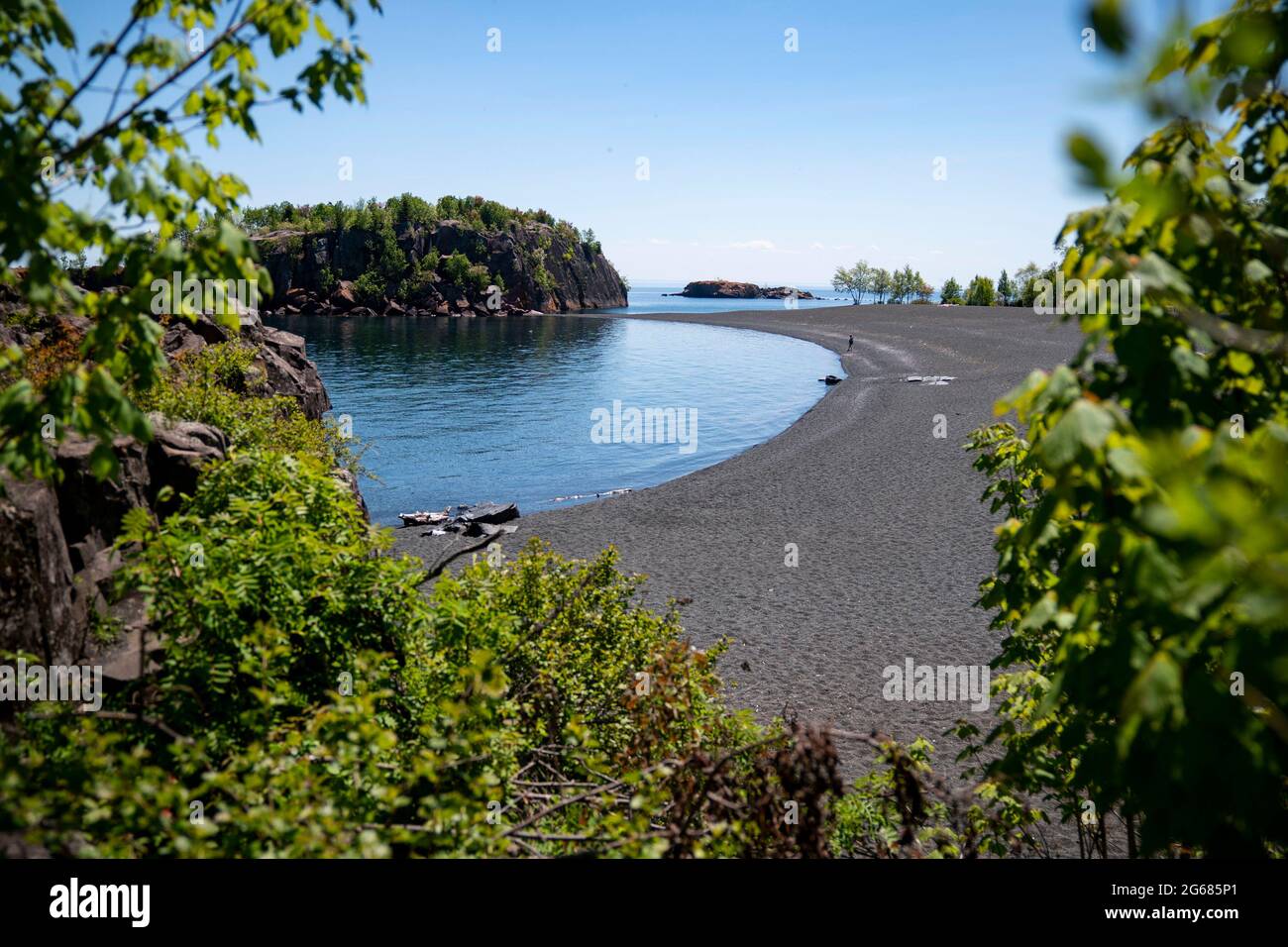 Black Beach is a secluded beach with black sand and picturesque cliffs ...