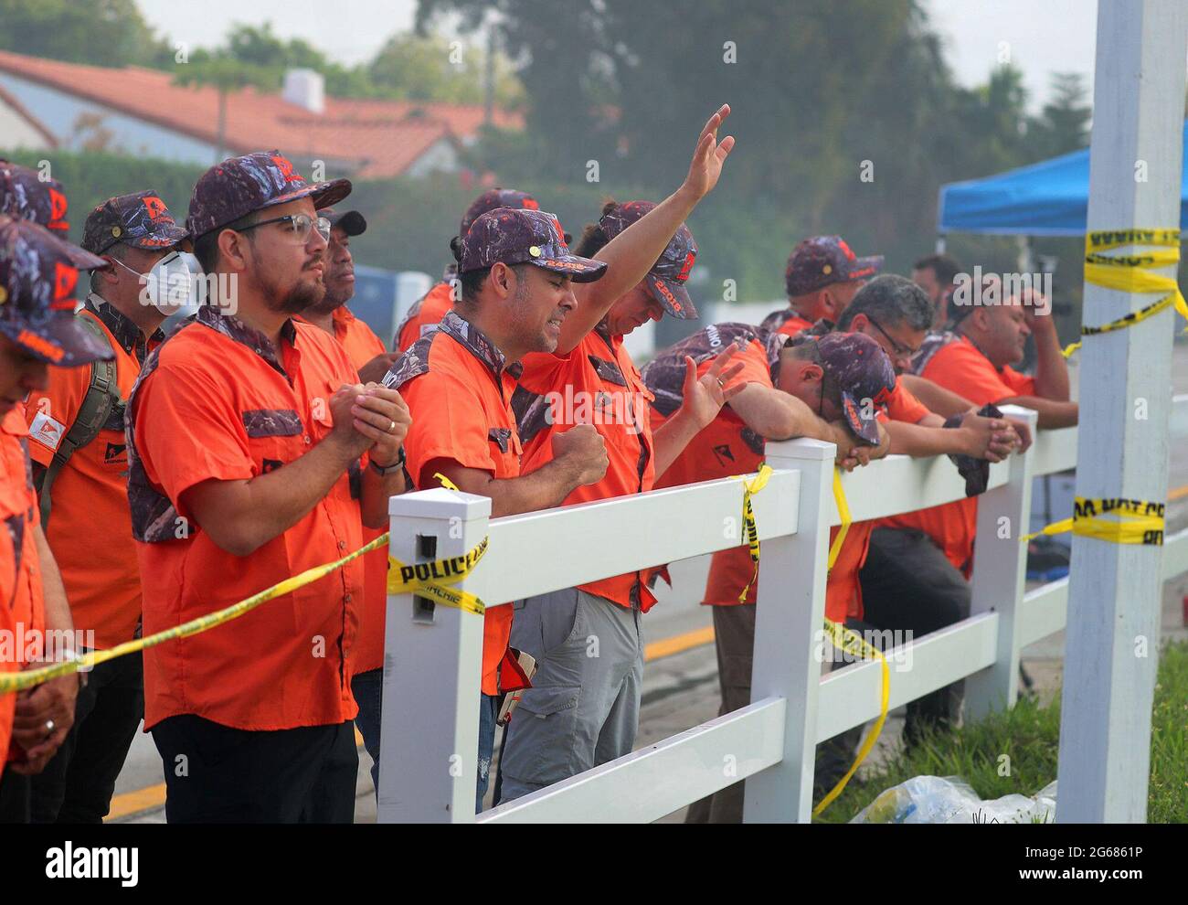 Members of the Legendarios, a mens religious group, gather on Saturday ...