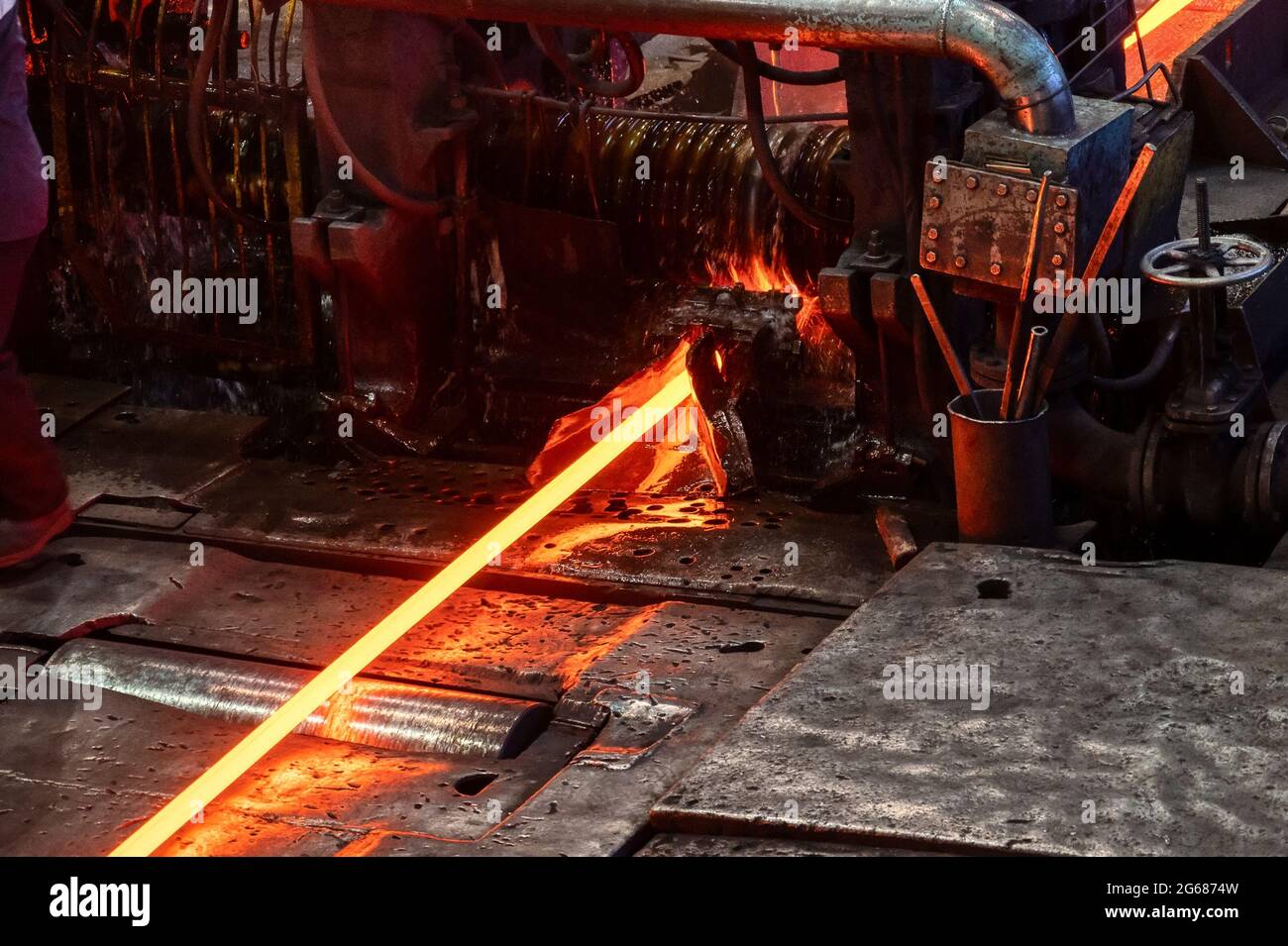 The process of rolling hot rolled steel in a rolling mill Stock Photo ...