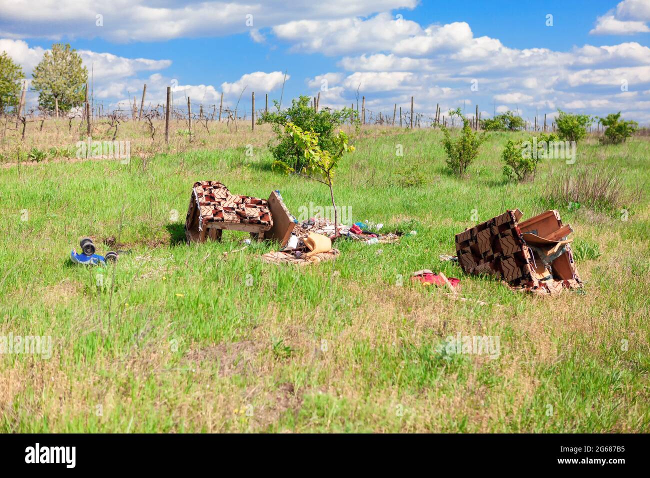 Garbage thrown on the meadow . Waste in Nature Stock Photo - Alamy