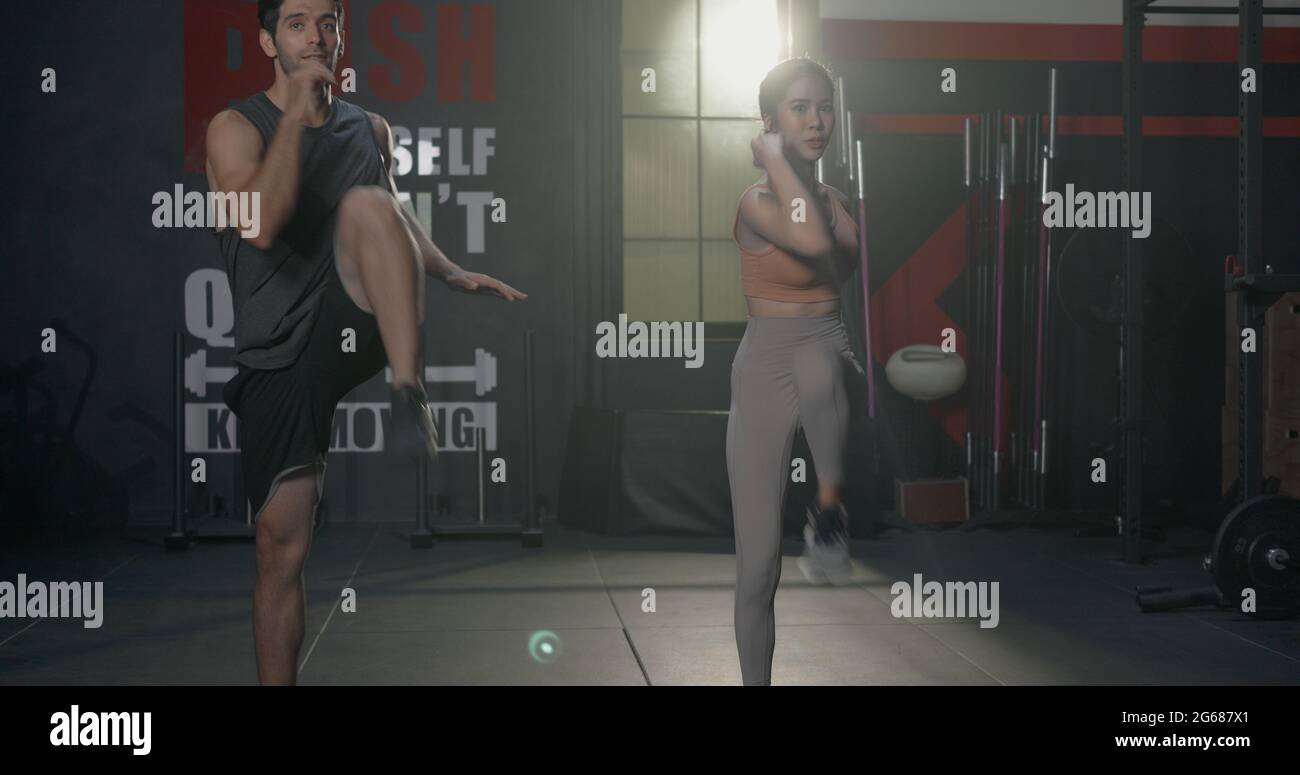 Two Muscular young Caucasian man and Asian woman doing laughing ...