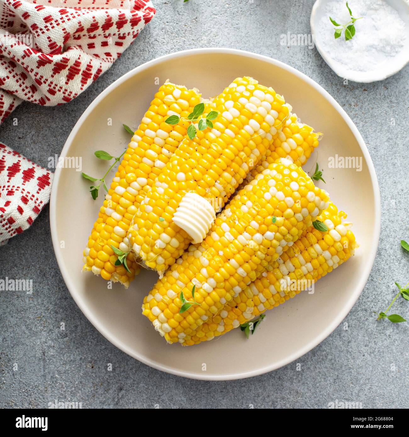 Cooked corn on the cob with salt and butter Stock Photo - Alamy