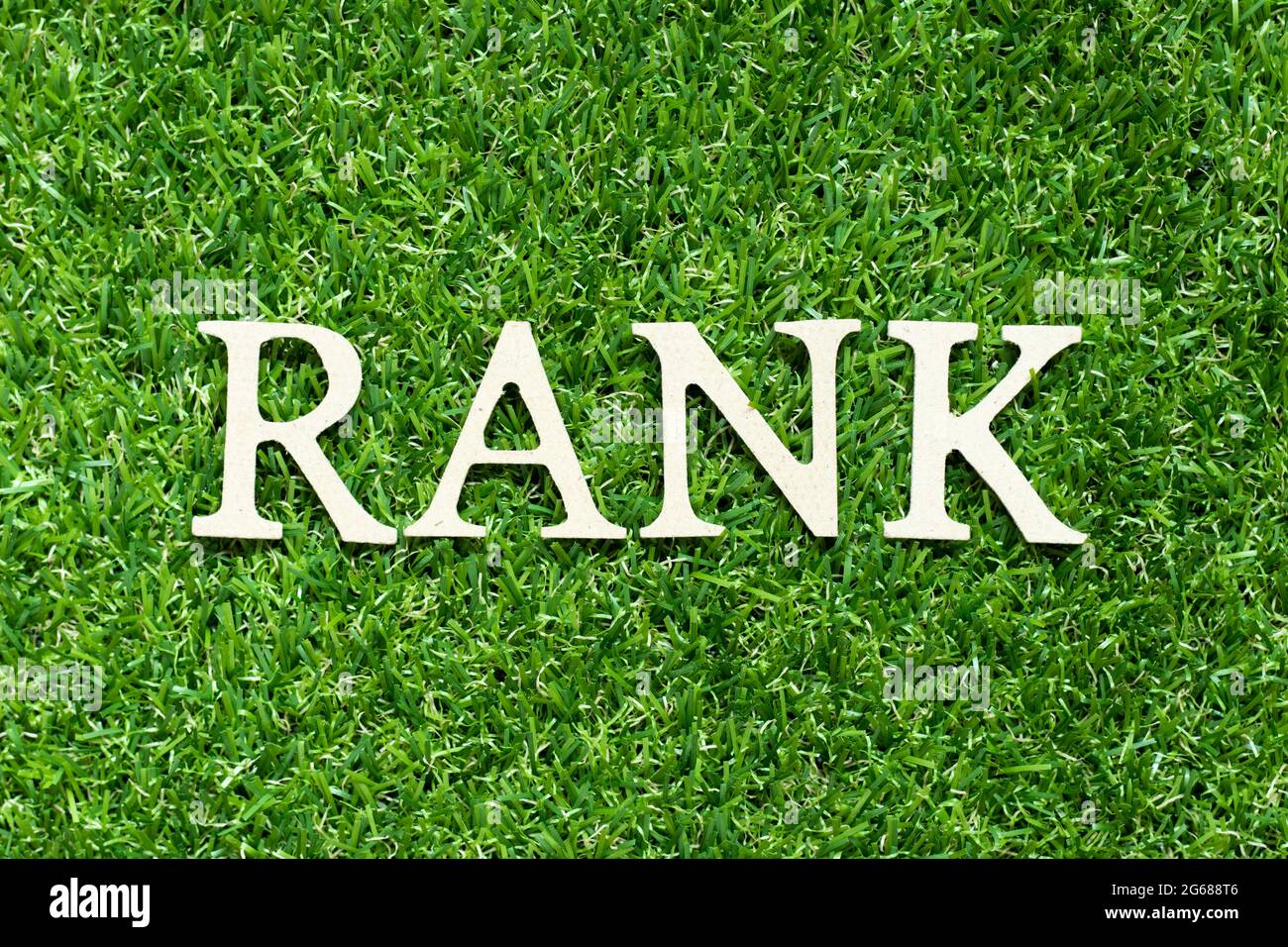 Alphabet letter in word rank on green grass background Stock Photo - Alamy