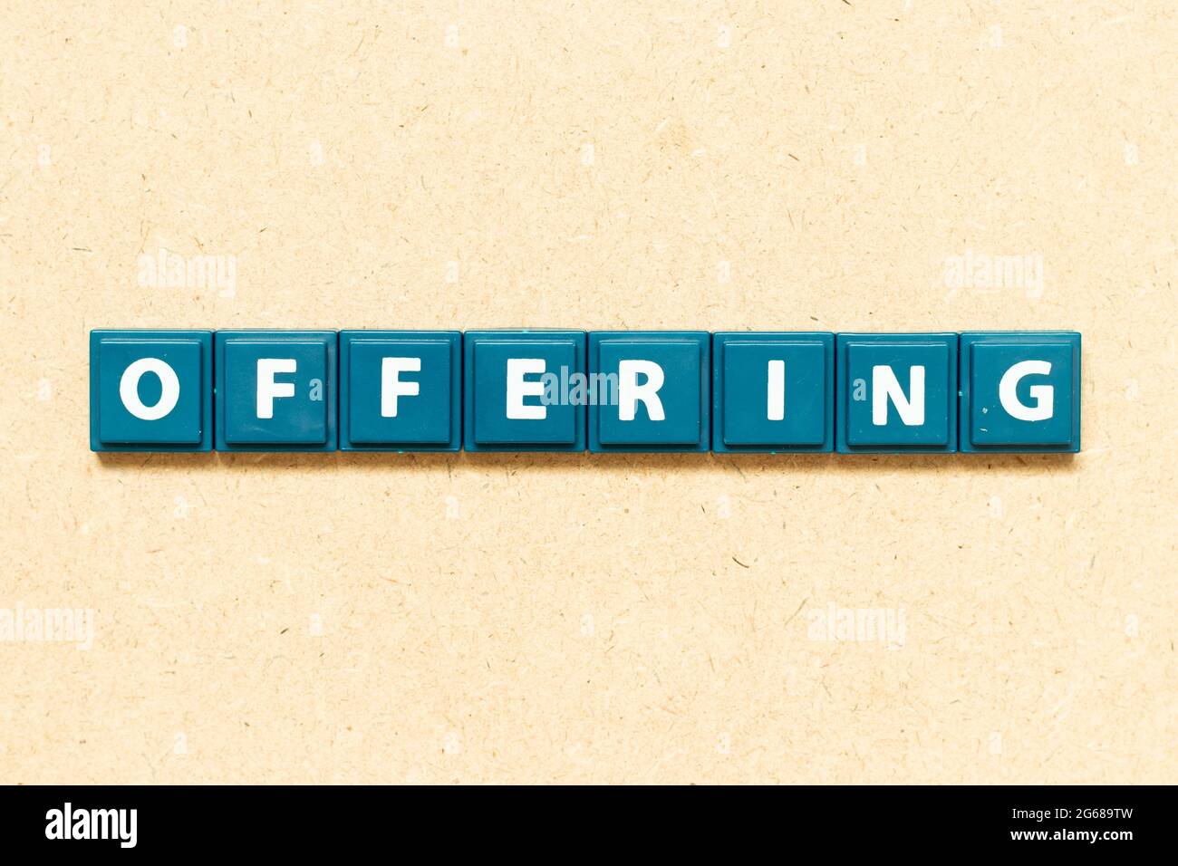 Tile alphabet letter in word offering on wood background Stock Photo ...