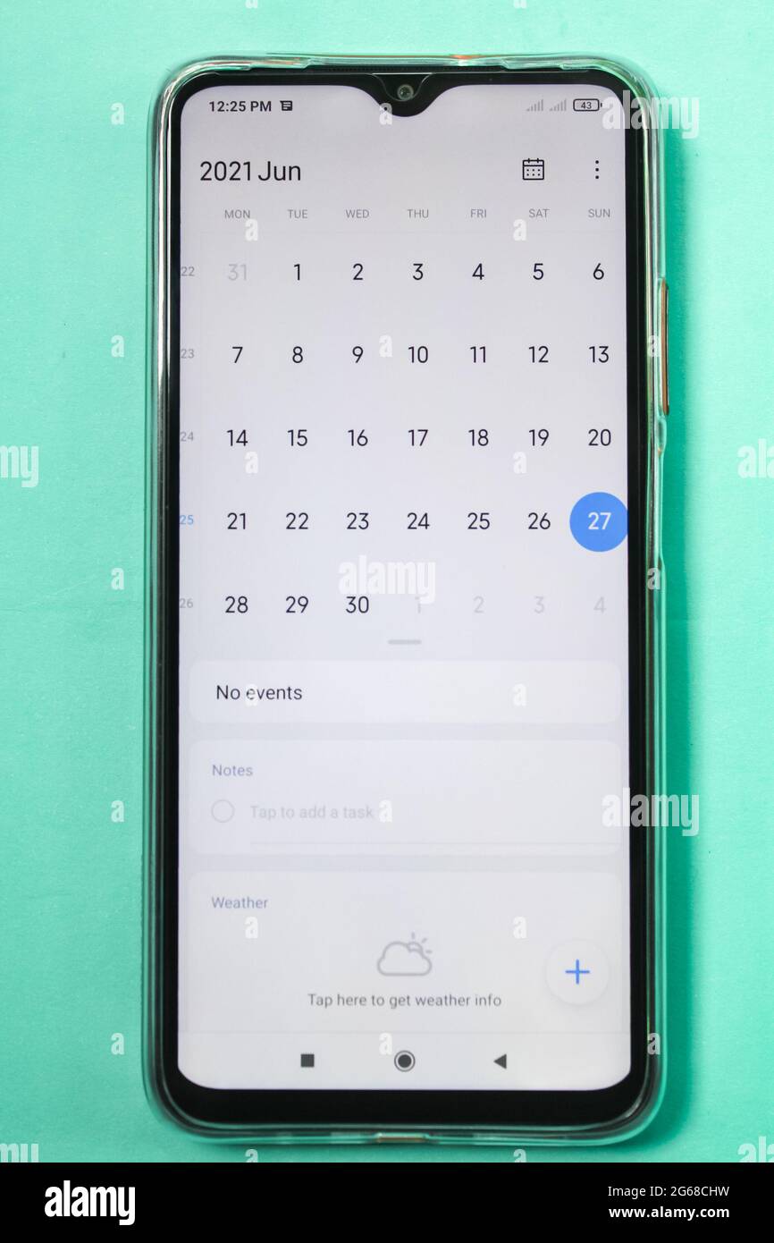 Mobile calendar concept on isolated surface Stock Photo - Alamy