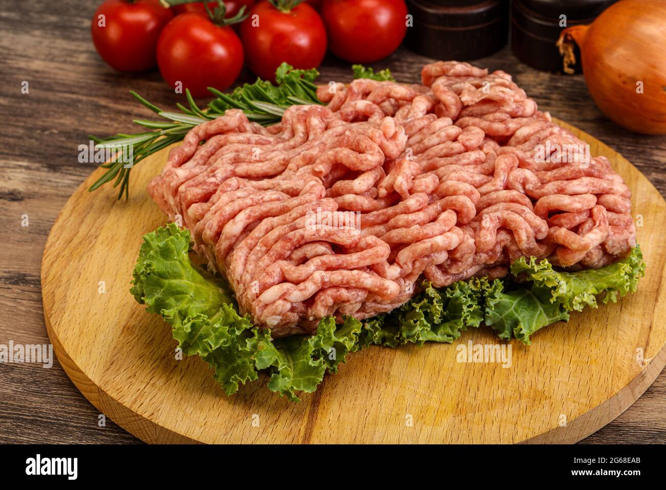 Raw pork minced meat over board for cooking Stock Photo - Alamy