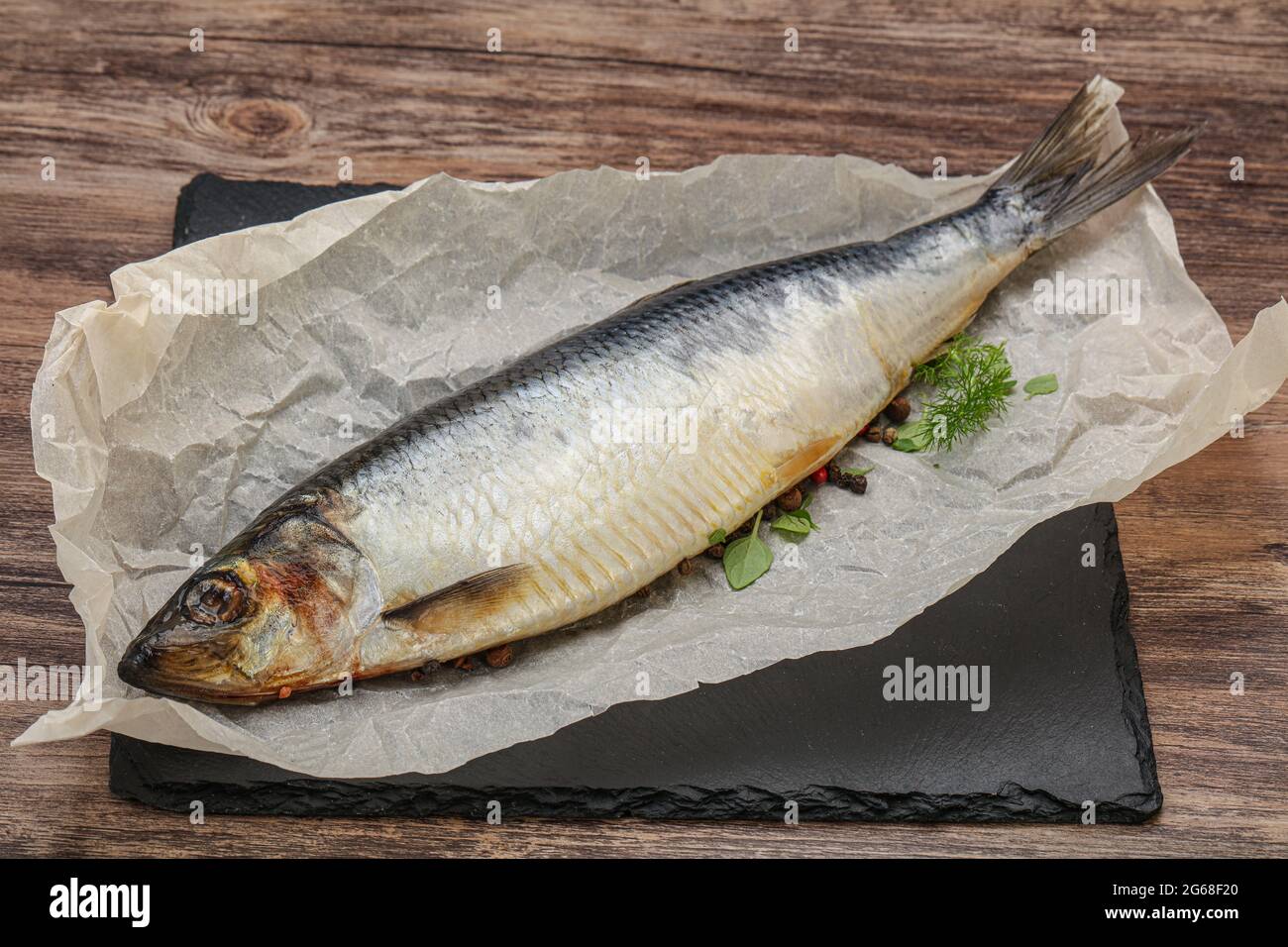 Salted Herring fish with pepper and spices Stock Photo - Alamy