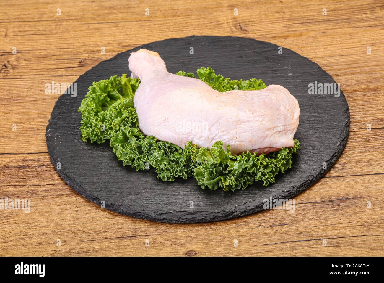 Raw uncooked chicken leg for cooking Stock Photo - Alamy