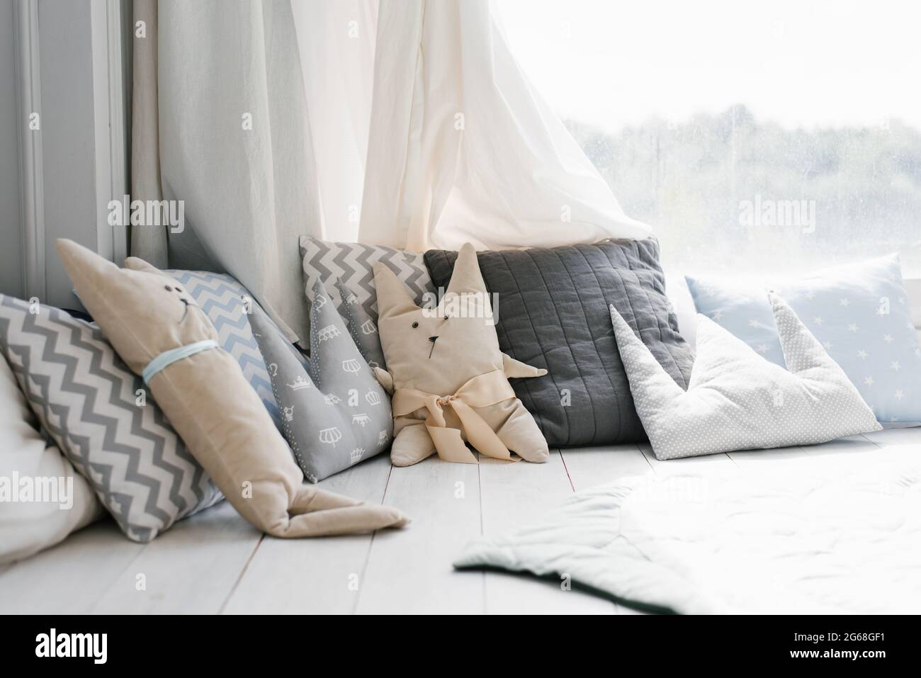 Children's colorful pillows in pastel colors. Pillows in the form of a ...