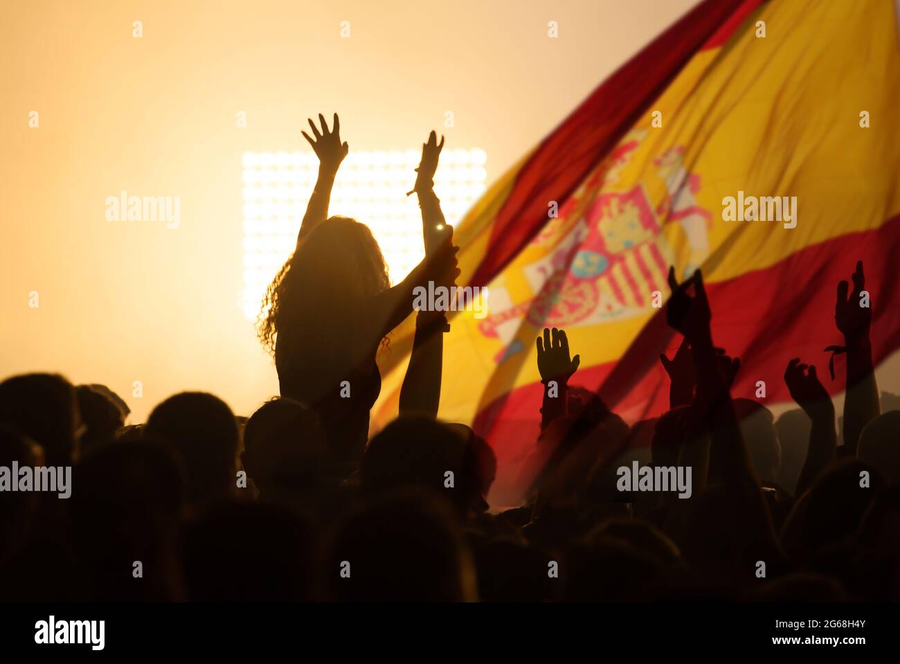 Football fans supporting Spain - crowd celebrating in stadium with ...