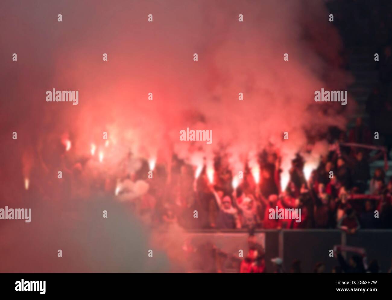 Soccer fans supporting - crowd celebrating in stadium with raised hands ...
