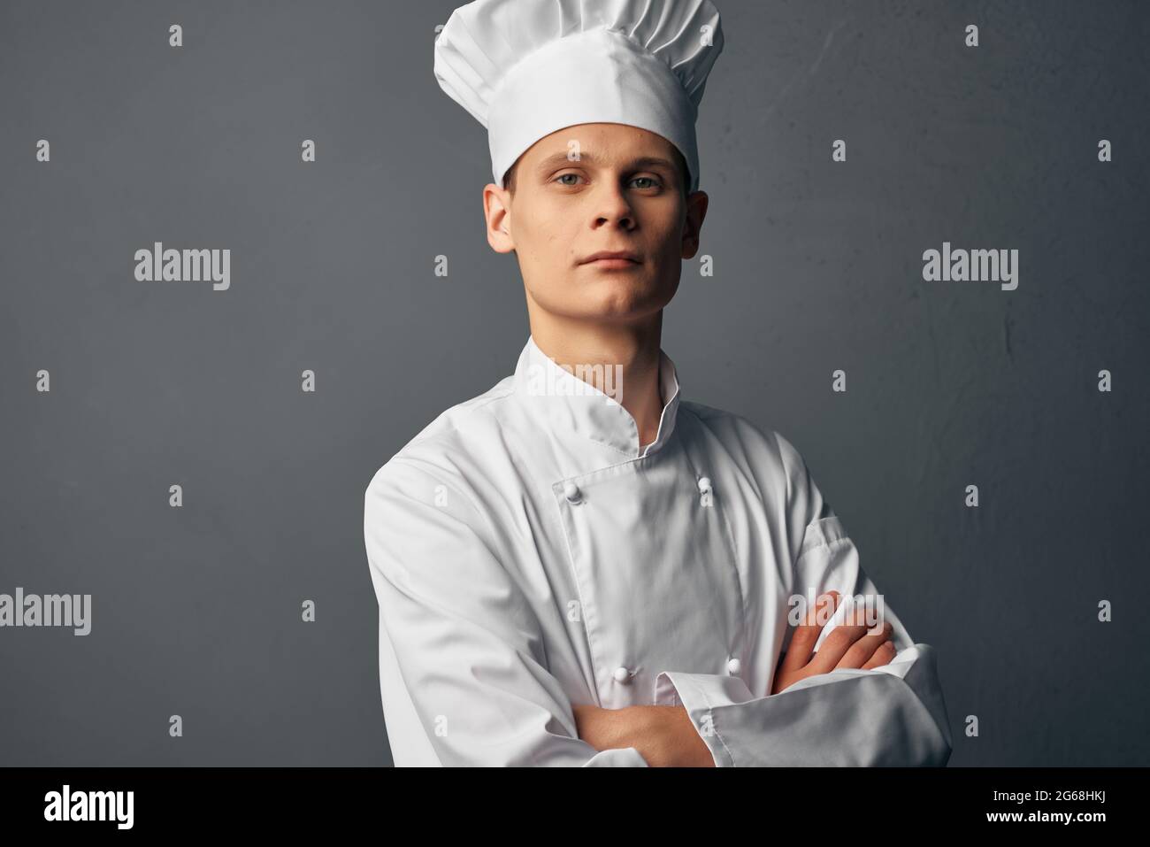 Cheerful chef folded his hands in front of him uniform work Stock Photo ...