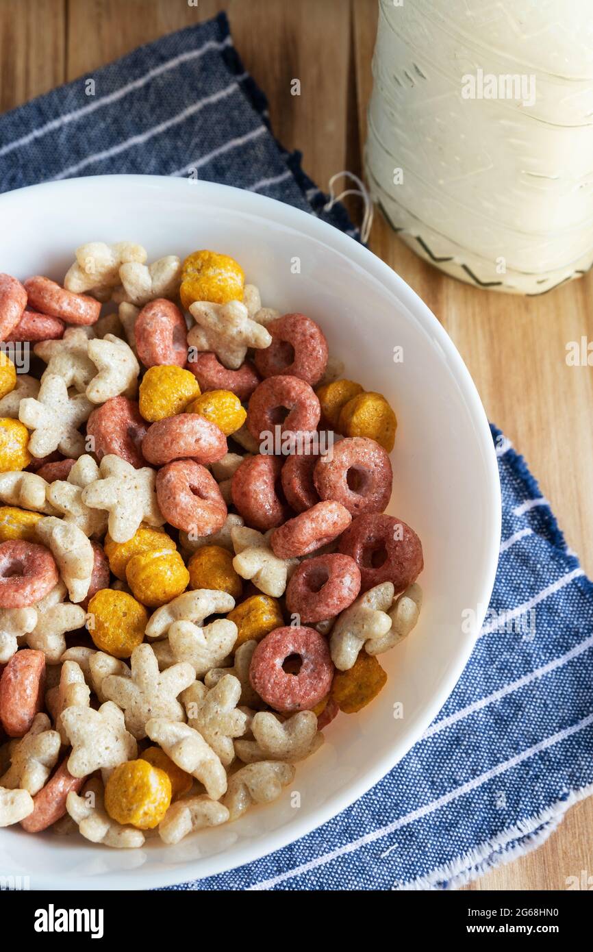 Colored cereals in a white bowl Stock Photo - Alamy