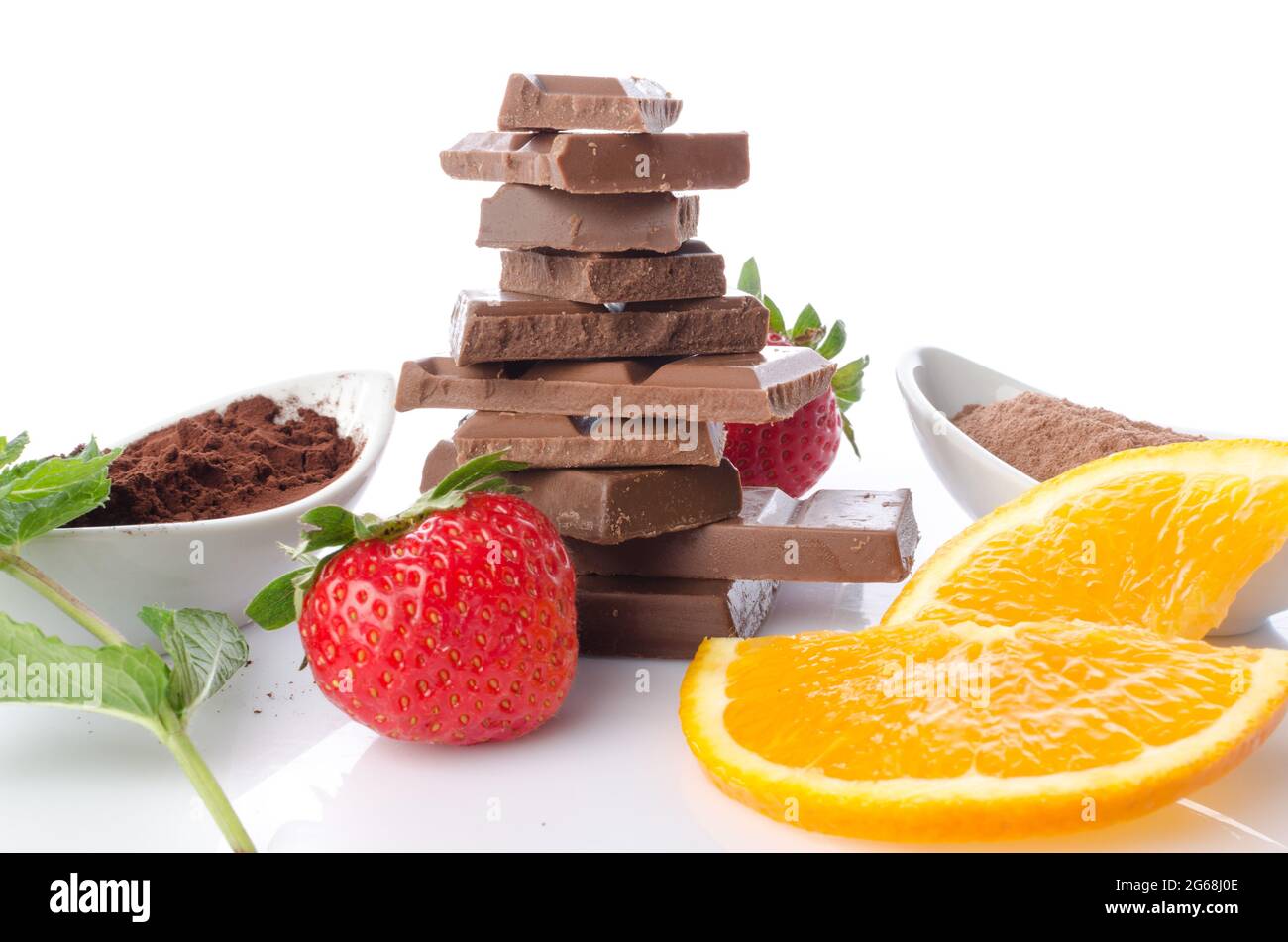 Stack of chocolate squares with cocoa powder, isolated on white Stock ...