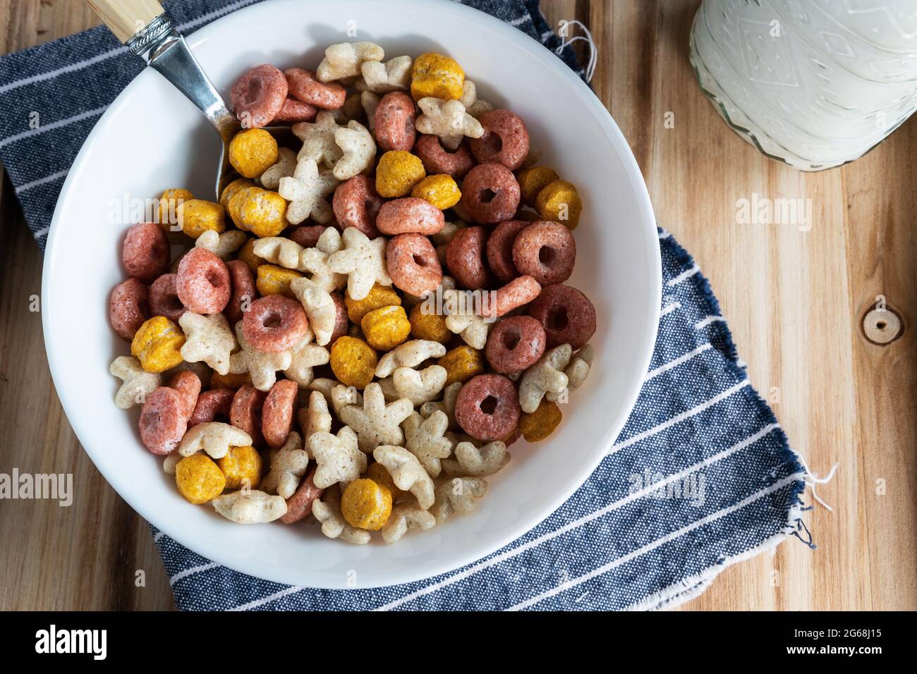 Colored cereals in a white bowl Stock Photo - Alamy