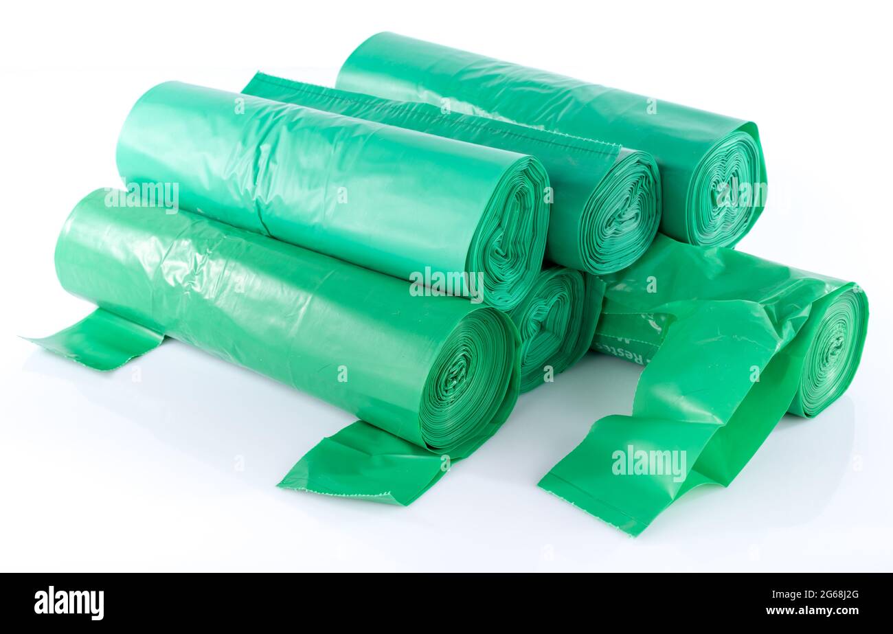 Stack of green garbage bags, isolated on white Stock Photo - Alamy
