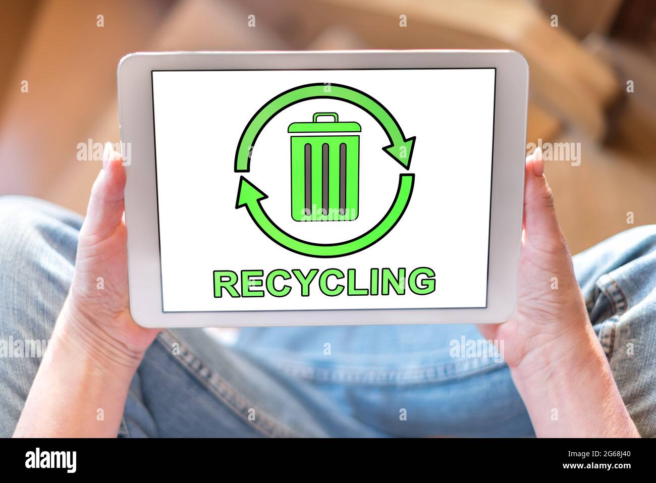Tablet screen displaying a recycling concept Stock Photo - Alamy