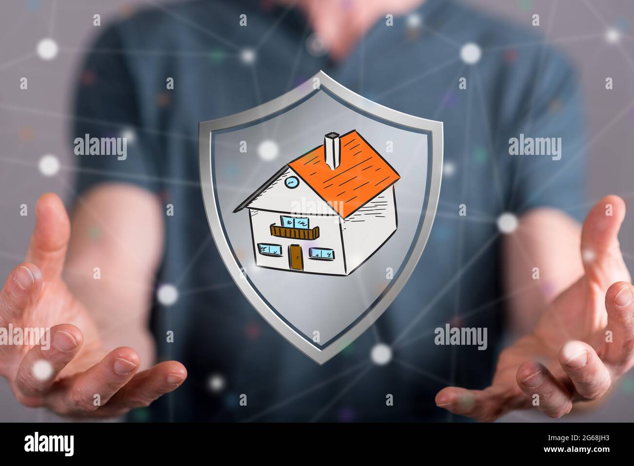 House protection concept between hands of a man in background Stock ...