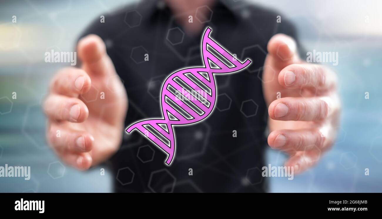 Dna technology concept between hands of a man in background Stock Photo ...