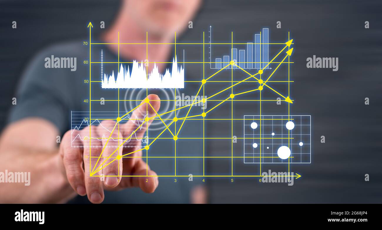 Man touching business charts on a touch screen with his finger Stock ...