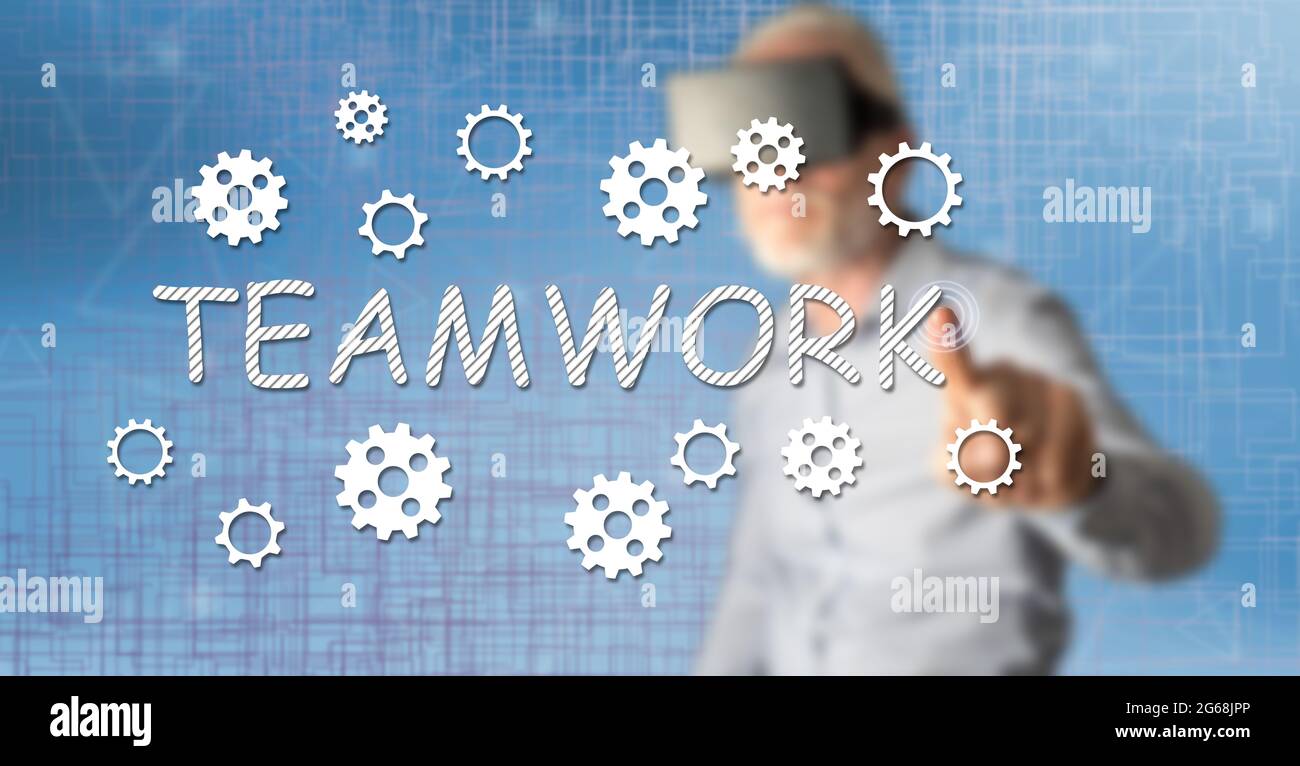 Man with vr headset touching a teamwork concept on a touch screen with ...