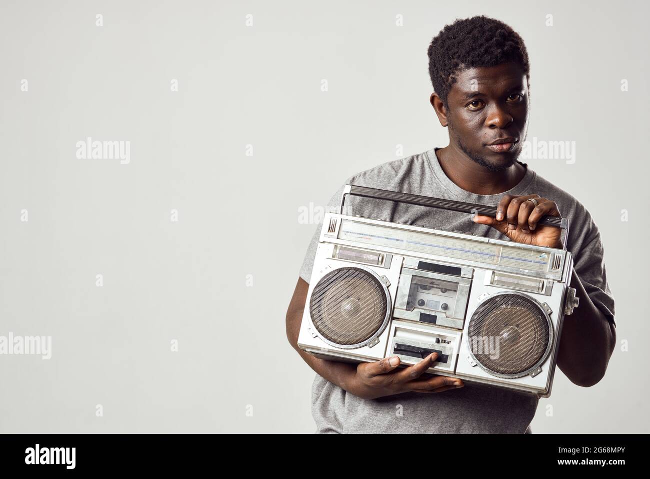 man with a tape recorder in his hands listening to music african ...
