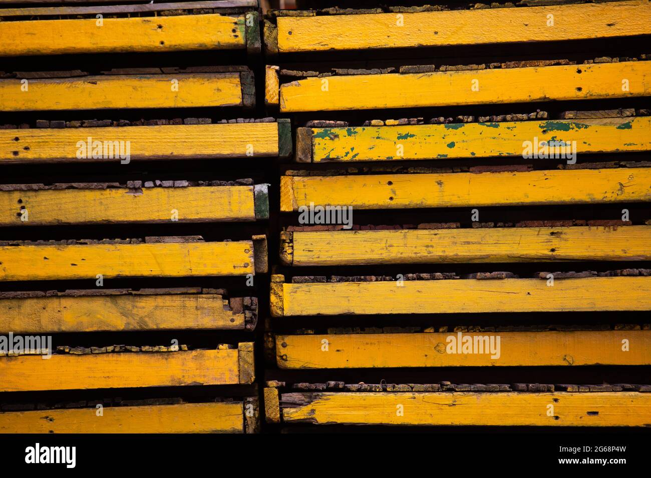 The yellow wooden boxes on top of each other Stock Photo - Alamy