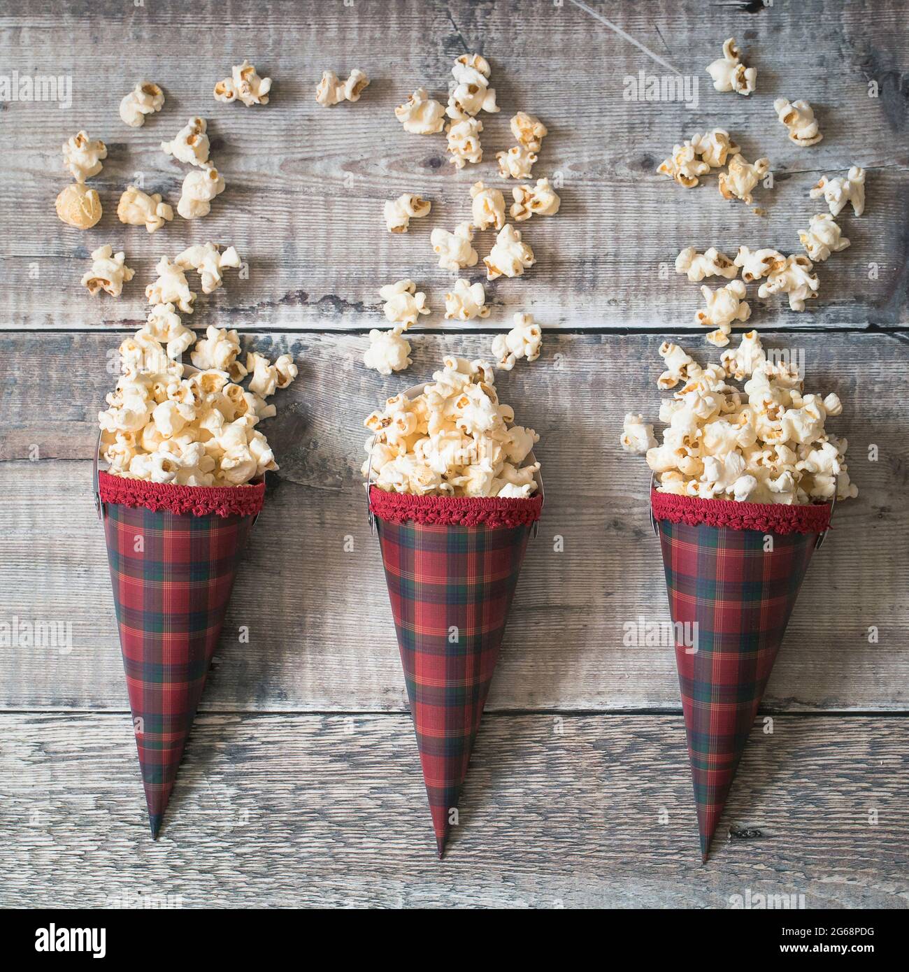 Flat lay of three cones of popcorn, retro style processing Stock Photo ...