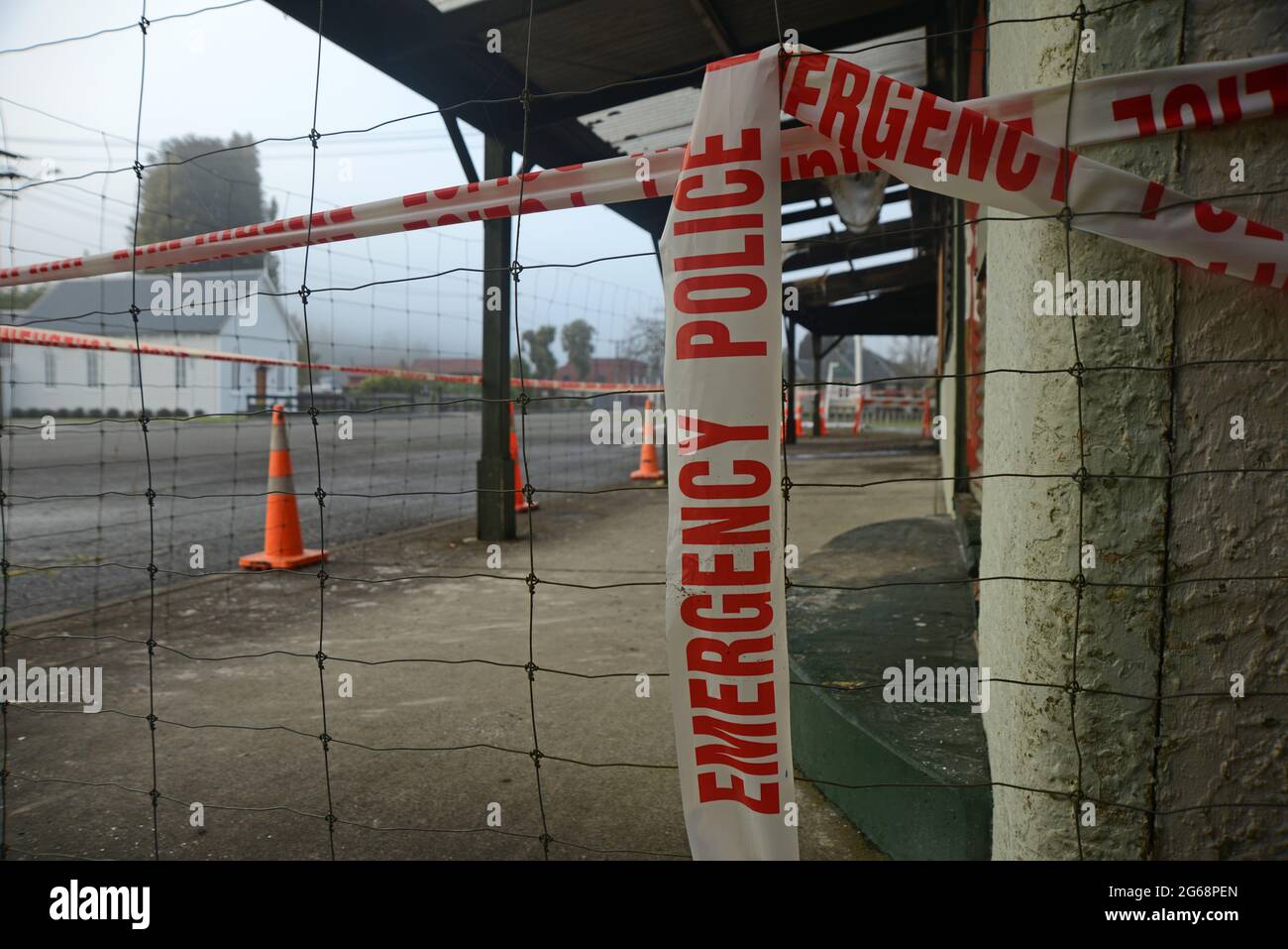 police emergency tape prevents public access at a suspected crime scene ...