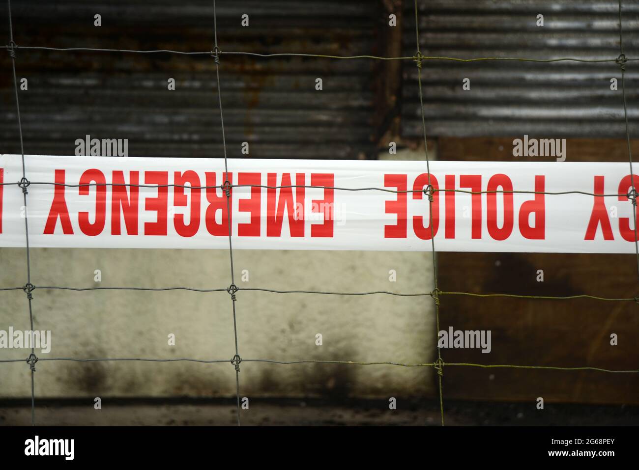 police emergency tape prevents public access at a suspected crime scene ...