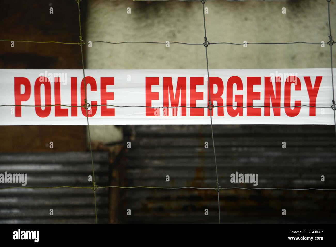 police emergency tape prevents public access at a suspected crime scene ...