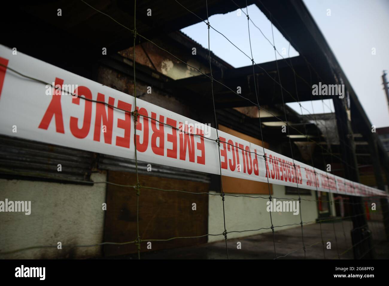 police emergency tape prevents public access at a suspected crime scene ...
