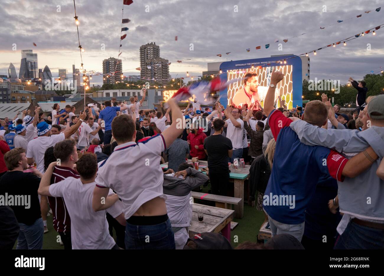 England football fans and supporters at a rooftop beer garden in London ...