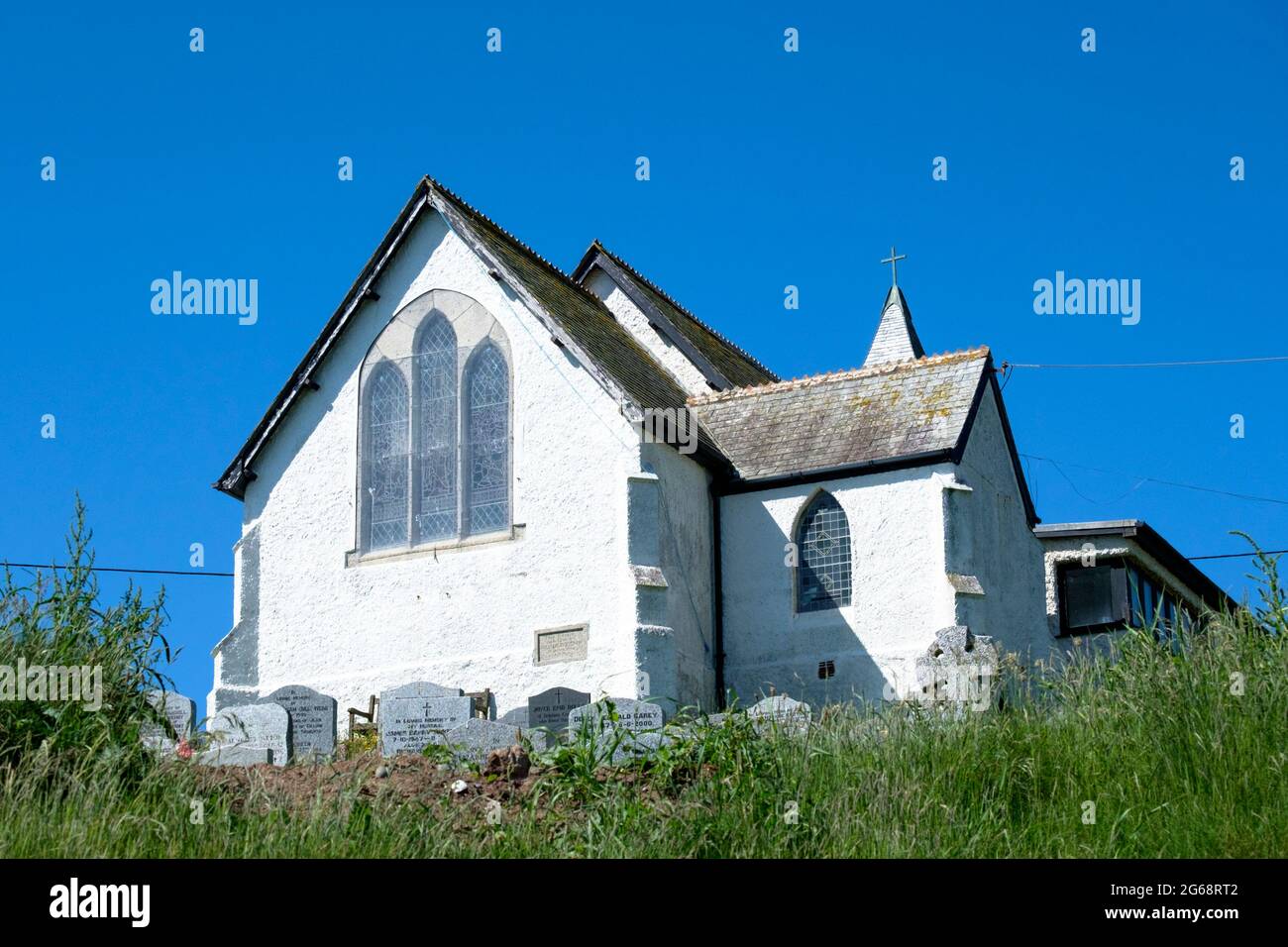St Peter's church overlooking the harbour at coverack Stock Photo - Alamy