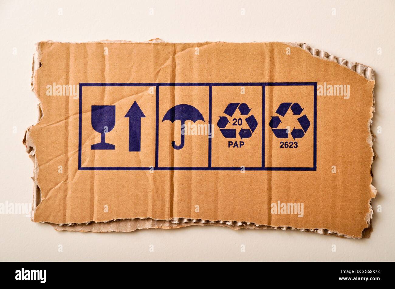 Brown and beige colored corrugated cardboard and warning signs detail ...