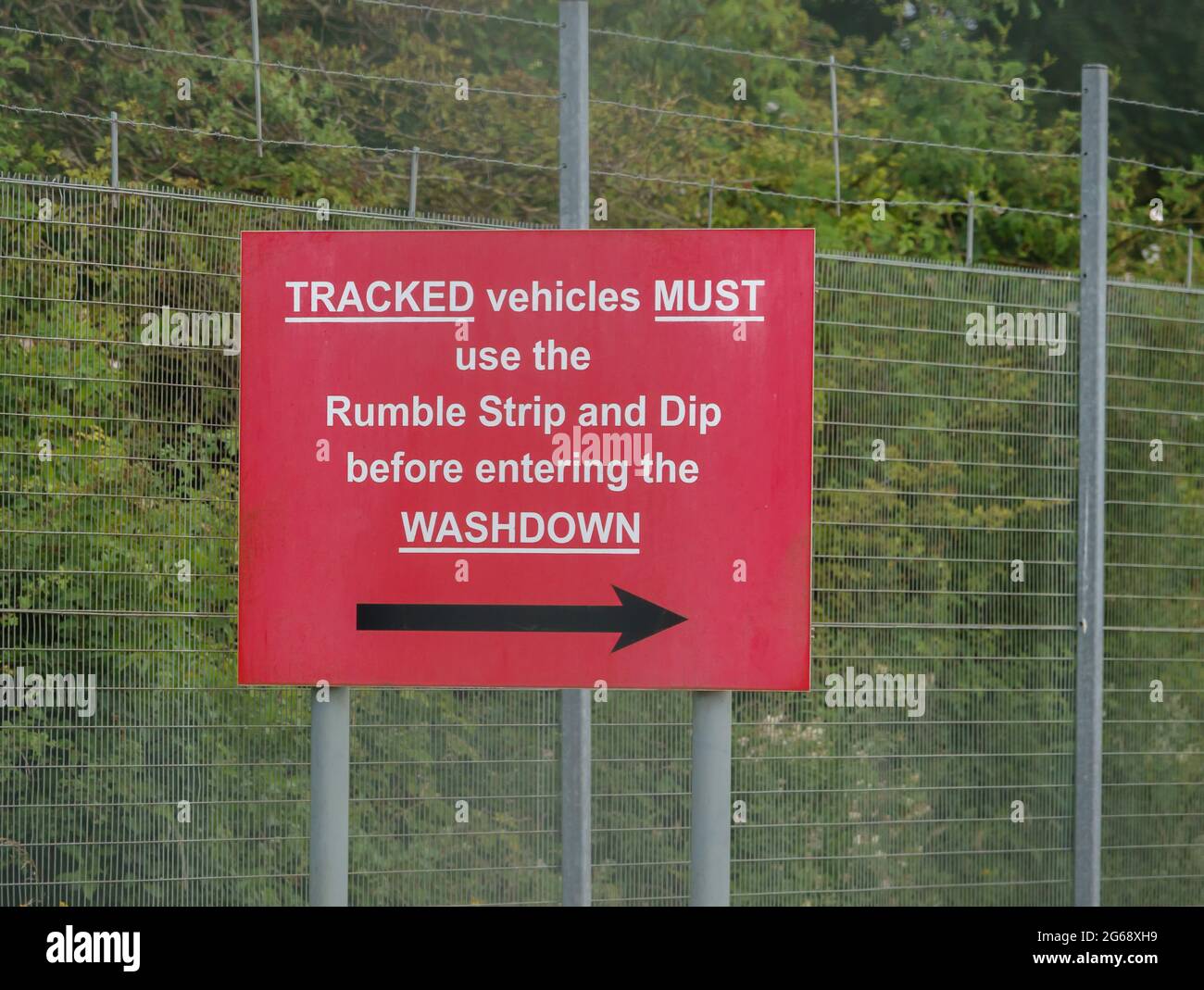 large bright red sign instructing military tank and tracked vehicles to ...