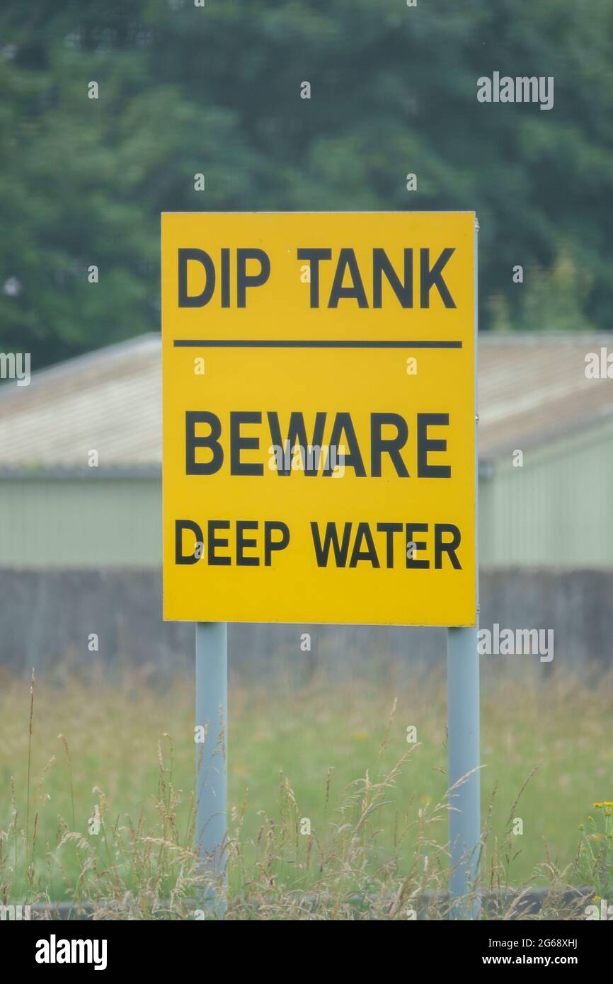 large yellow sign instructing military tank and tracked vehicles to ...