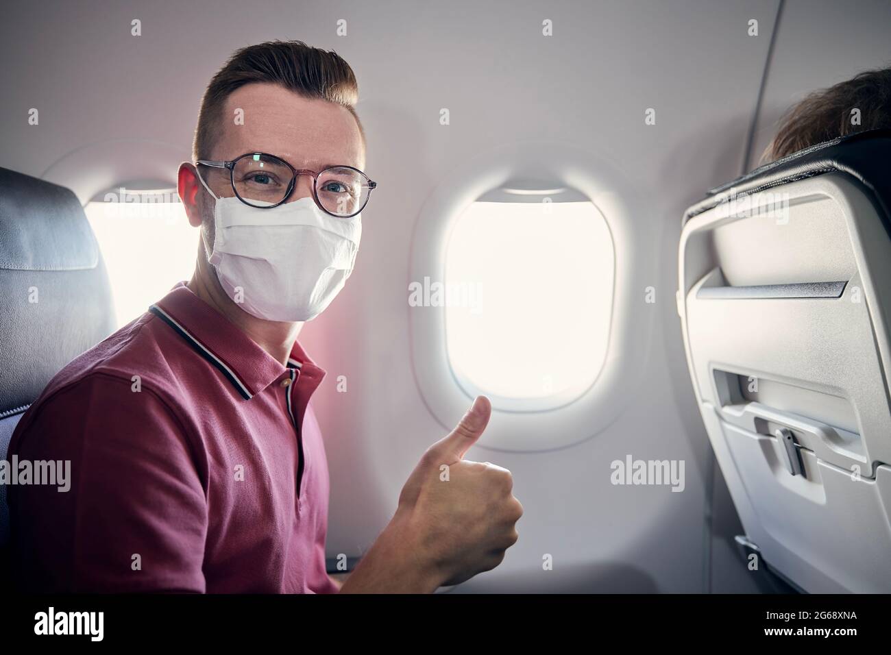 Smiling face airplane hi-res stock photography and images - Alamy