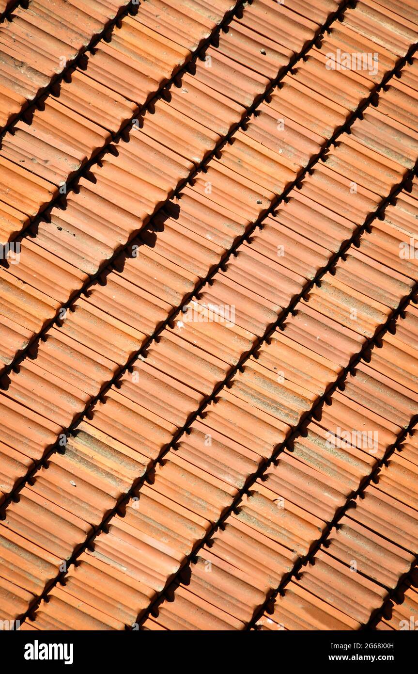 Red terracotta tiles of a building, repetitive roof texture background ...