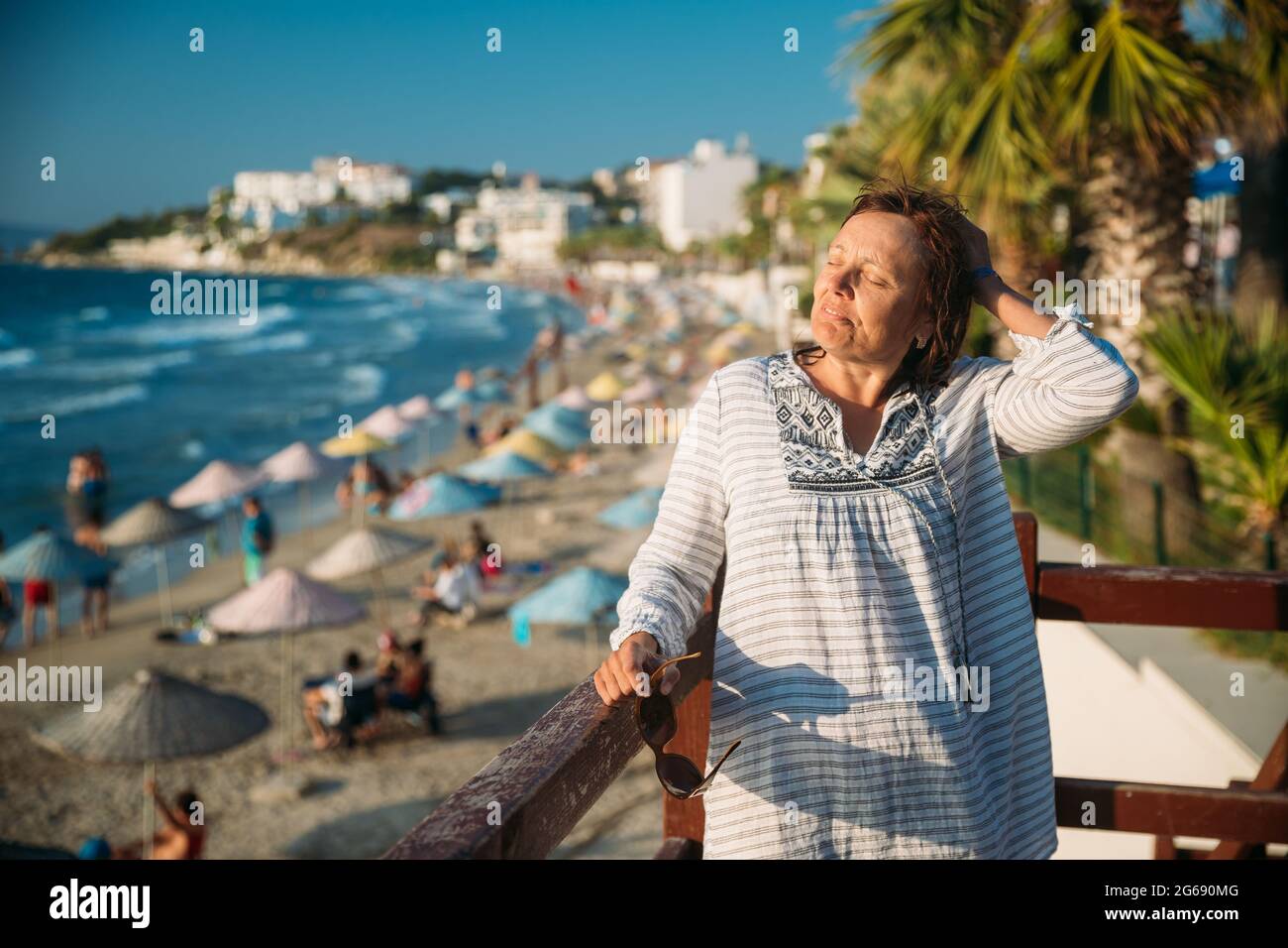 Adult Caucasian Woman Relaxed Posing On Sunset Beach Vacation On Sea