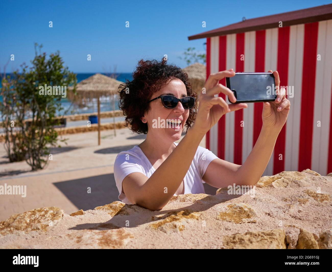 Young woman beach hut hi-res stock photography and images - Alamy