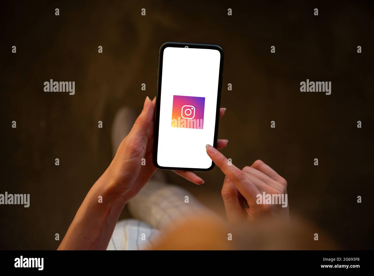 Instagram logo hand screen hi-res stock photography and images - Alamy