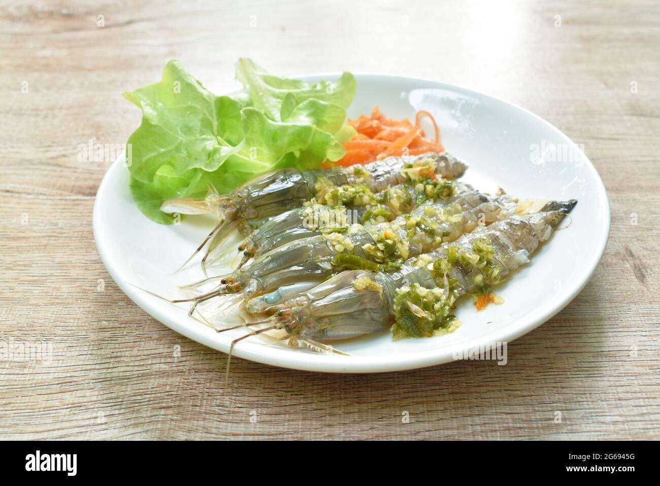 raw mantis shrimp dressing spicy and sour fish sauce Thai food on plate ...