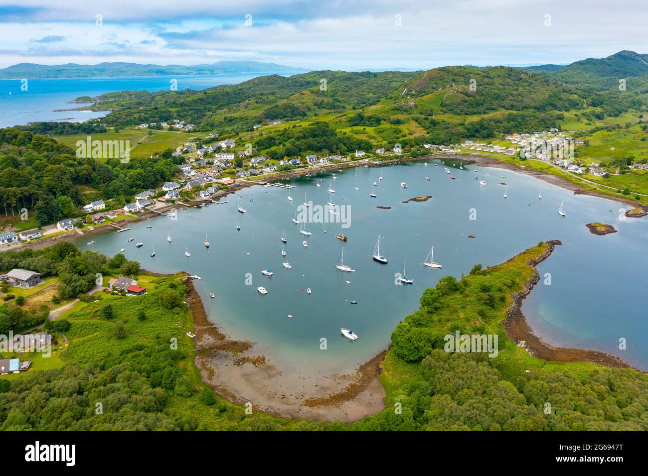 Aerial view from drone of village and harbour at Tayvallich on Loch ...