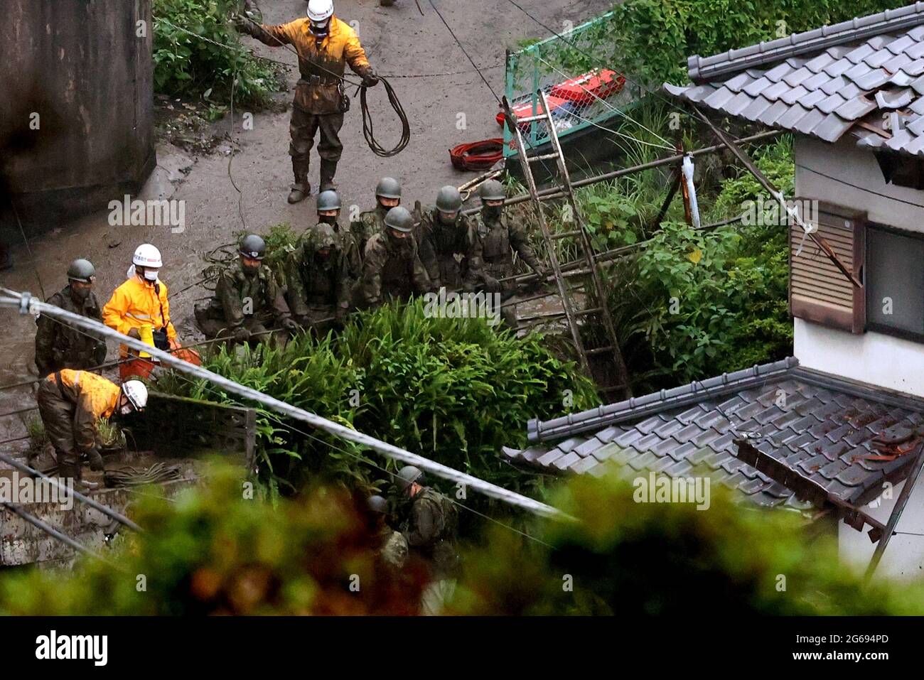 Atami, Japan. 4th July, 2021. Rescue workers, police officers and Self ...