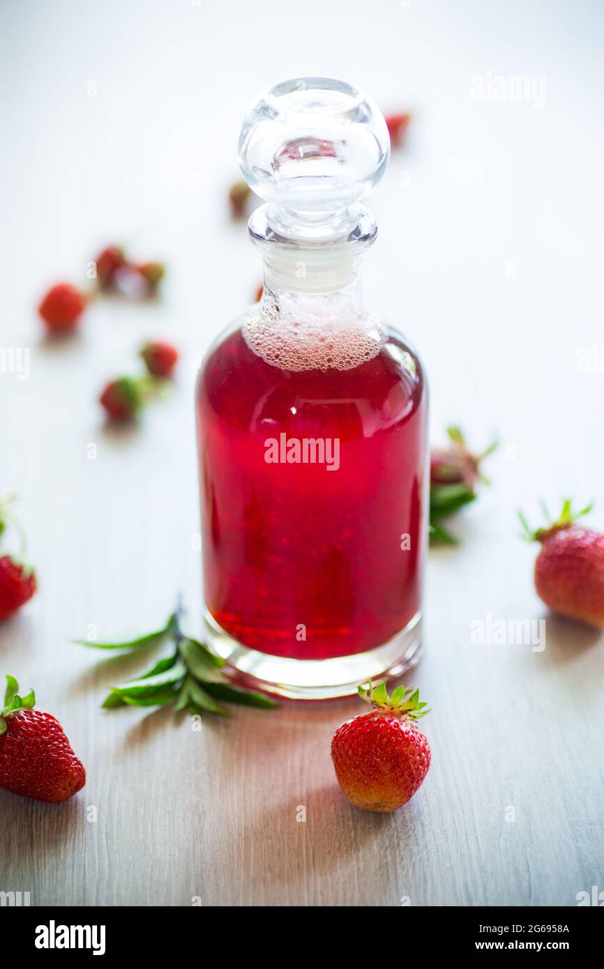 sweet cooked strawberry syrup in a glass decanter Stock Photo - Alamy