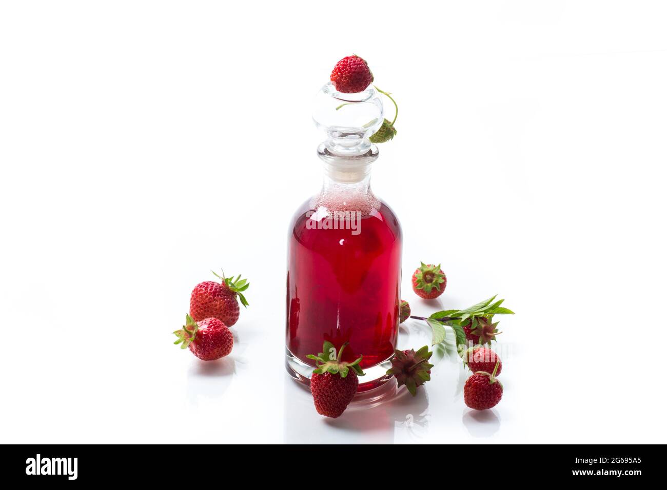 sweet cooked strawberry syrup in a glass decanter Stock Photo - Alamy