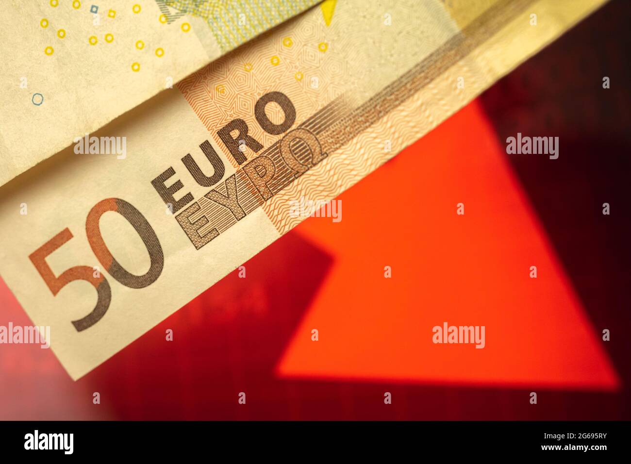 Euro falls finance and business background, Euro banknotes and red ...